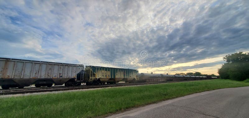 Across the tracks. stock image. Image of train, clouds - 214515617