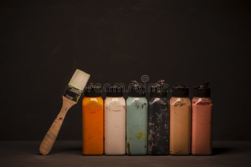 Acrylic Paint Bottles Set and Paintbrush on Dark Background. Copy Space ...