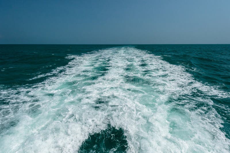 Acting Wave Behind Motor Boat Stock Photo - Image of splatter, movement ...