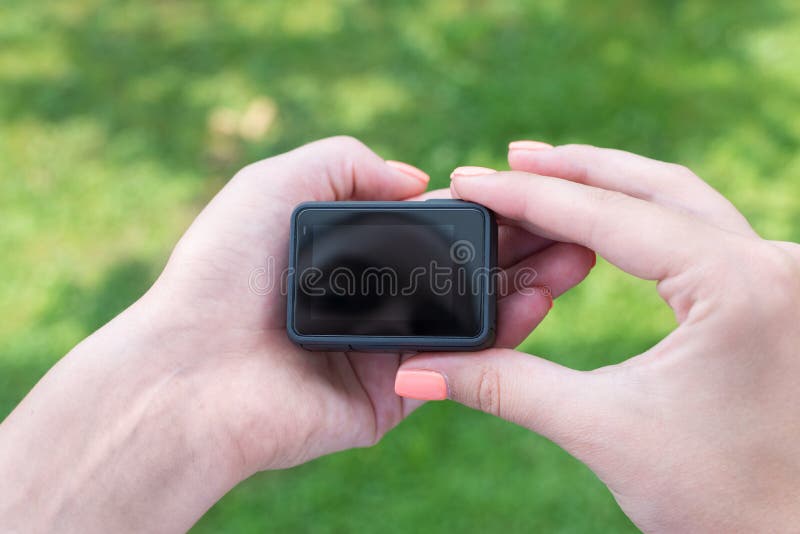 Action Camera in Hands. Blank Screen for Mockup Stock Photo - Image of ...