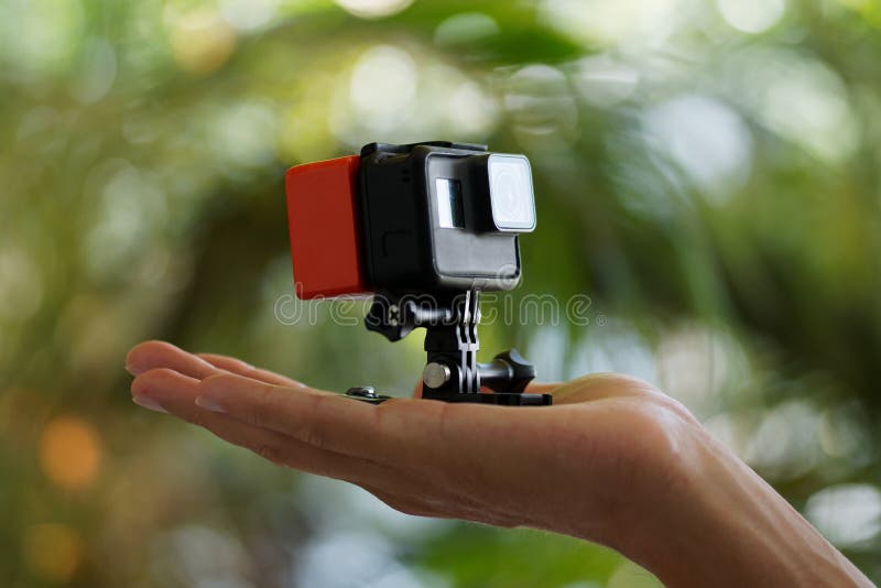 Action Camera with Orange Float in Man Hand . Stock Image - Image of ...