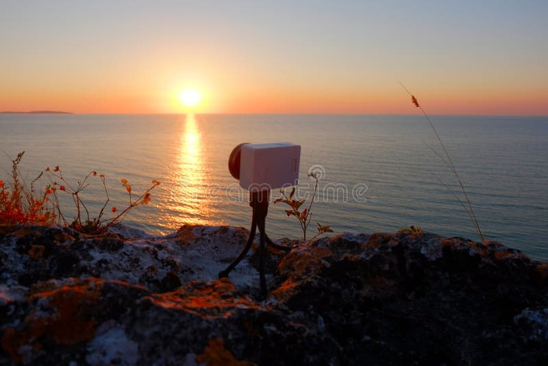 Action Camera Taking Pictures of Setting Sun for Timelapse Stock Image ...