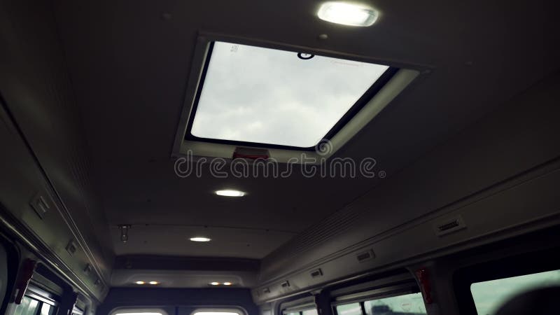 Activating the Interior Light in a Minibus during a Cloudy Afternoon ...