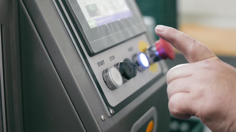 Activating Machinery Control Panel, Finger Pressing Start Button on an ...