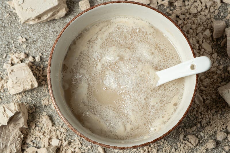 Activation of Wet Fresh Yeast in Warm Water with Sugar. Stock Photo ...