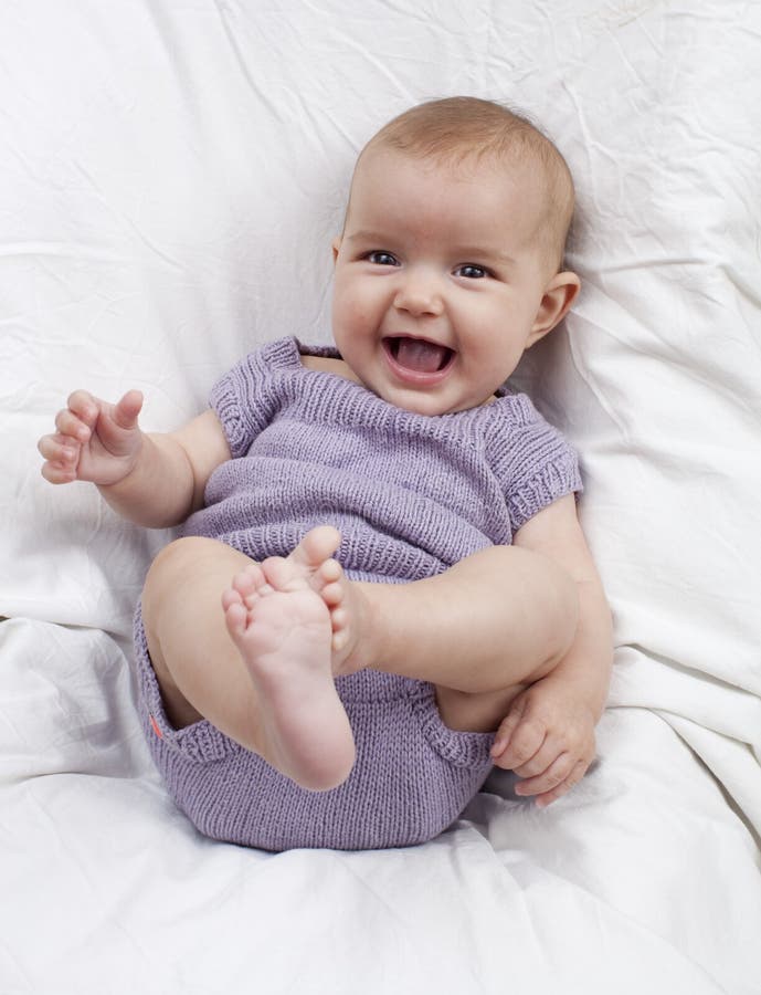 Cute Baby Sniffing His Feet Stock Photo - Image of caucasian, funny ...