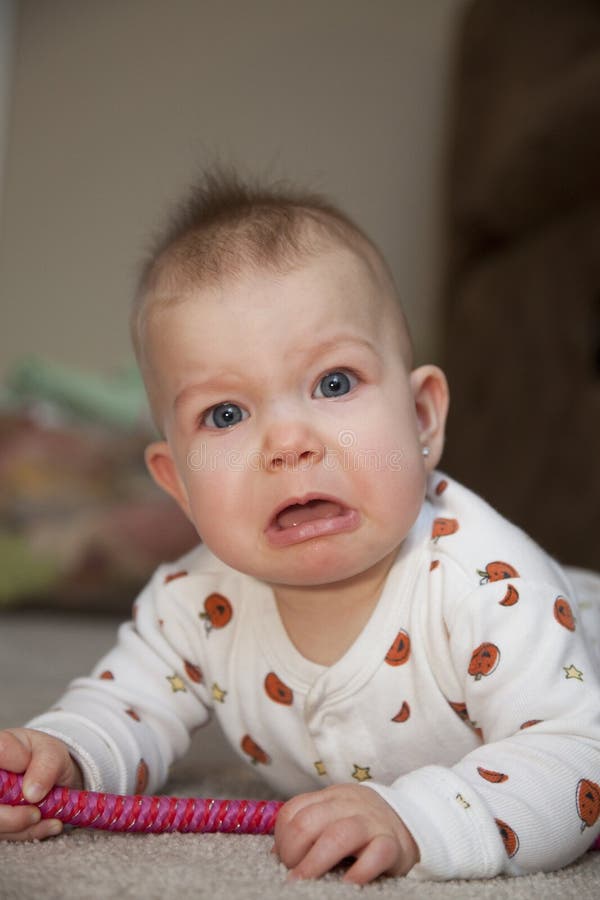 Active baby unhappy stock image. Image of girl, expression - 9096457