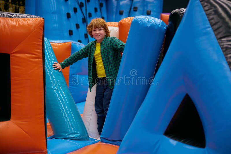 Active Boy Child Feeling Excited Playing in Inflatable Castle Stock ...