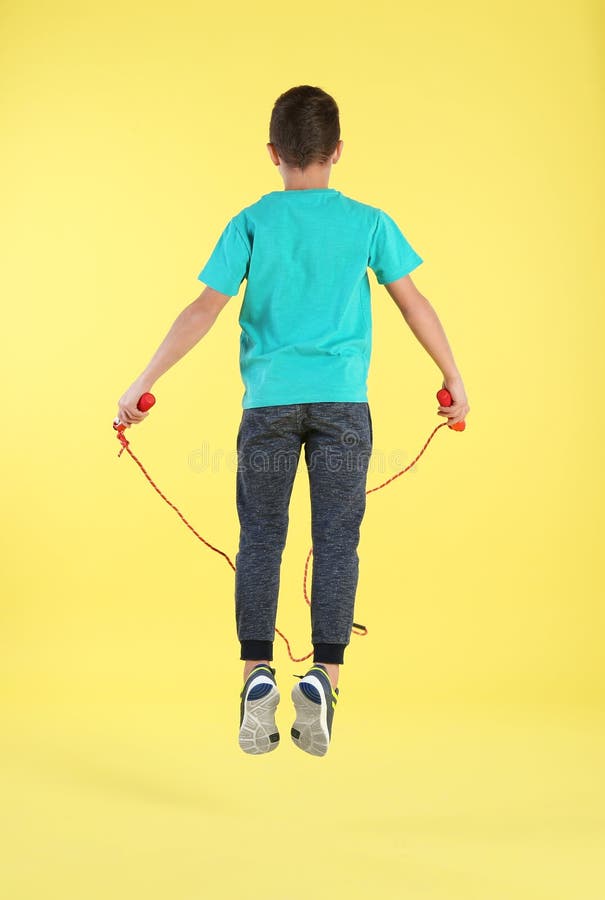 Active boy jumping rope stock photo. Image of fitness - 136553898