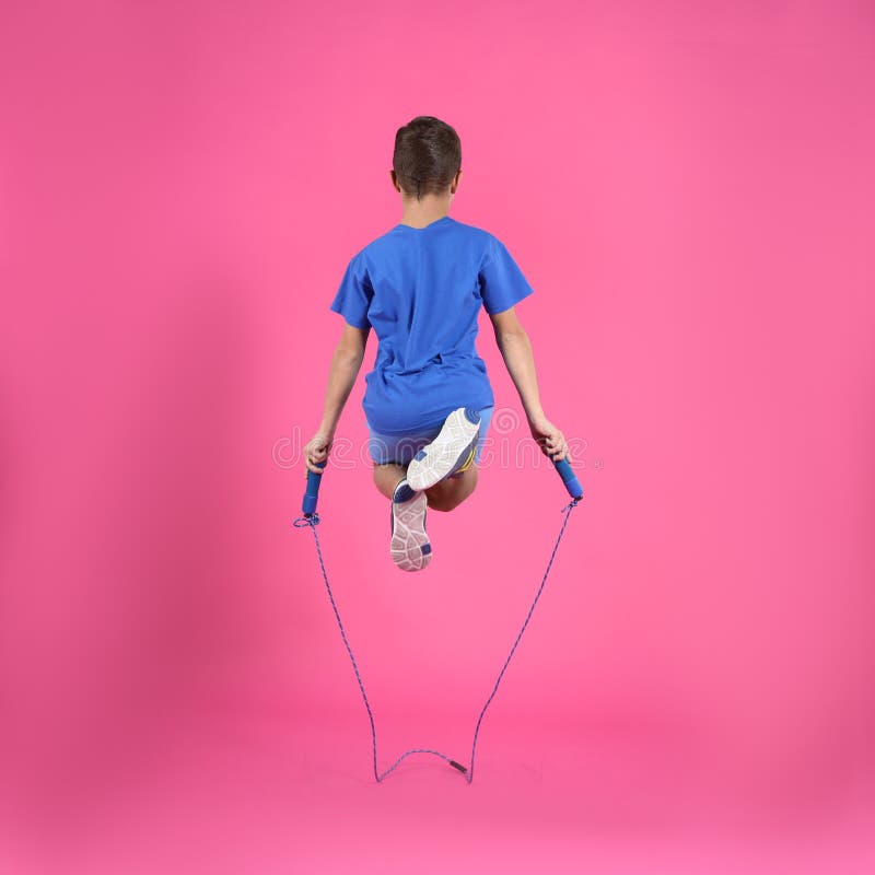 Active boy jumping rope stock photo. Image of action - 136553868