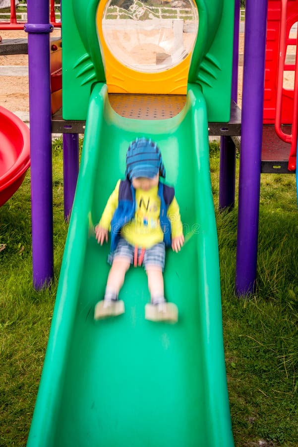 Active Boy at Playground, Sliding Down Stock Image - Image of little ...