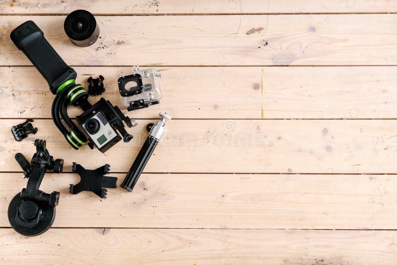 Active Camera on Table. Wooden Background. Studio Shot. Stock Photo ...