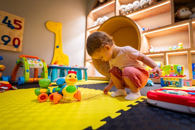 Active Child Playing in a Vibrant and Interactive Play Area Filled with ...
