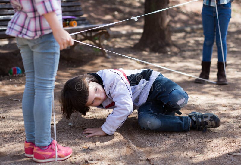 Active Children Games. Boy Gently Passes through the Tangled Rop Stock ...