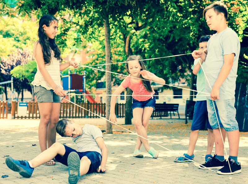 Children Games. Girl Goes through the Tangled Rope Stock Photo - Image ...