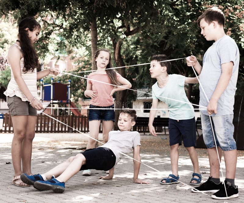Children Games. Girl Goes through the Tangled Rope Stock Photo - Image ...