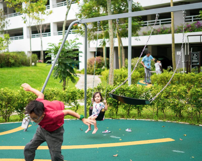 Active Children Playing at the Playground. Happy and Fun Time Stock ...