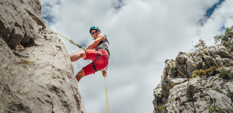 Active Climber Middle Age Man in Protective Helmet Looking at Camera ...