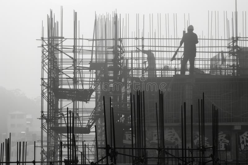 Active Construction Site with Workers, Machines, and Scaffolding ...