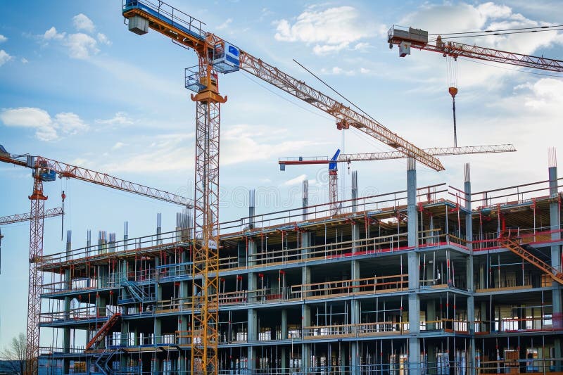 Active Construction Site with Workers, Machines, and Scaffolding ...