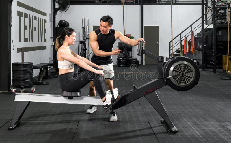 Active Couple Engaging in a Dynamic Workout Session at the Gym Stock ...