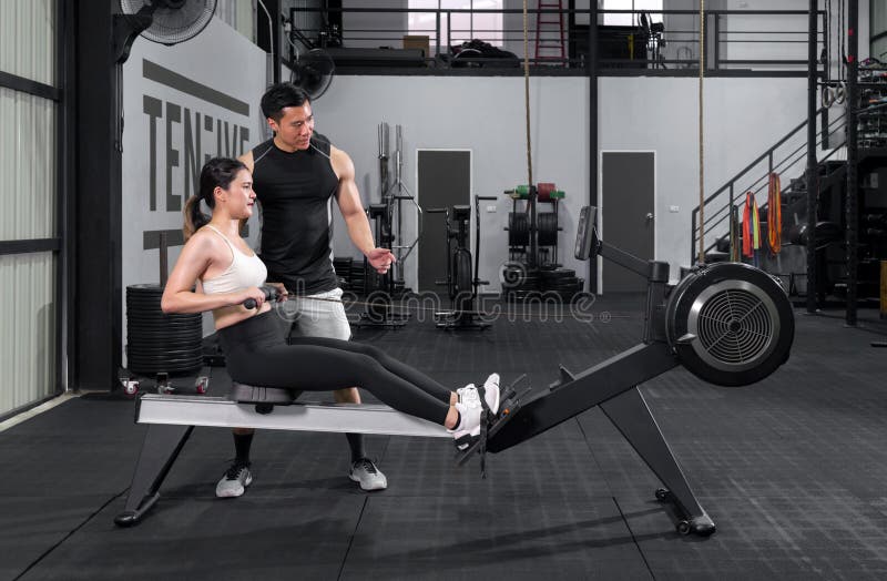 Active Couple Engaging in a Dynamic Workout Session at the Gym Stock ...
