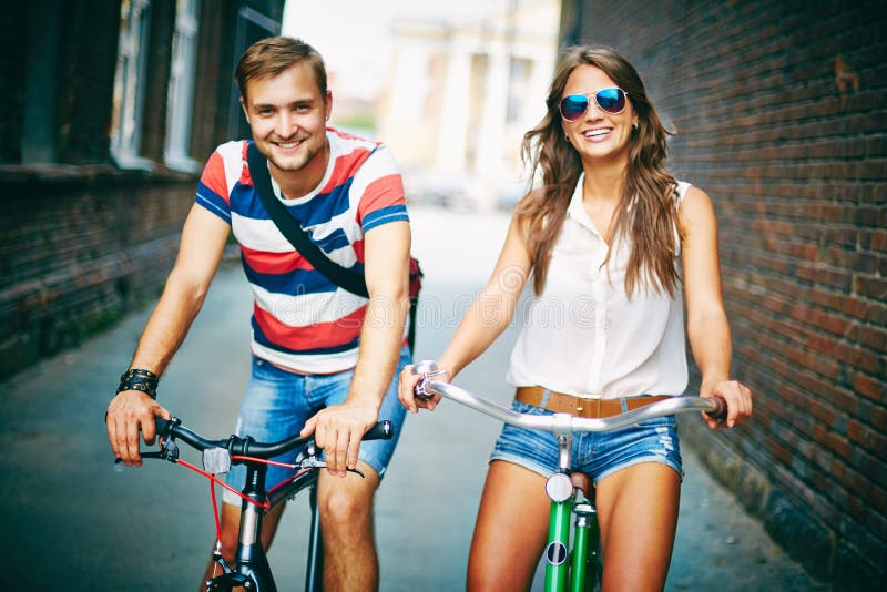 Active dates stock image. Image of couple, female, cycle - 57853051