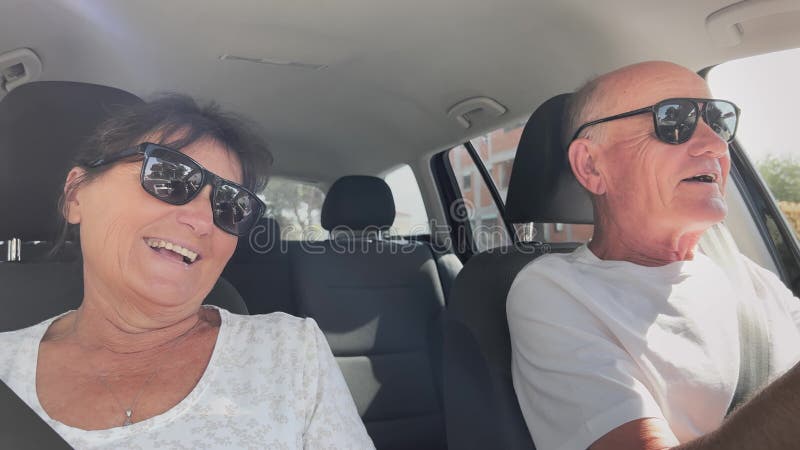 Active Elderly Married Couple Having Fun while Traveling by Car on a ...
