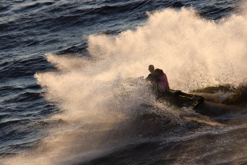 Active and Energetic Riding on a Jet Ski. Lots of Splashes Stock Photo ...