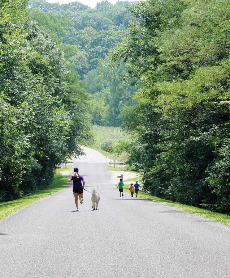 Active Family Running with the Dog Editorial Stock Image - Image of ...