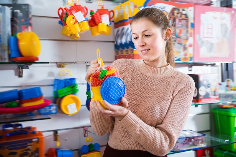 Active Female Looking Assortment of Plastic Toys Stock Photo - Image of ...