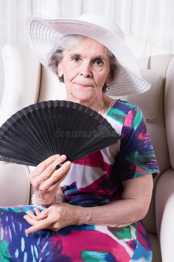 Active Female Senior with Fan in Her Hand Stock Image - Image of ...