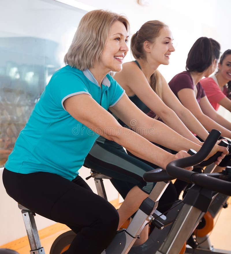 Active Females of Different Age Training on Exercise Bikes Stock Image ...