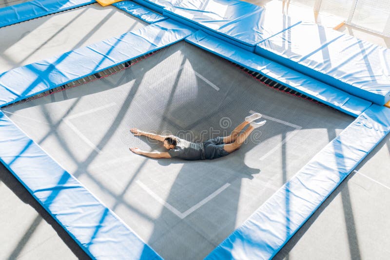 Active Funny Man Bouncing on Trampoline Along Stock Photo - Image of ...