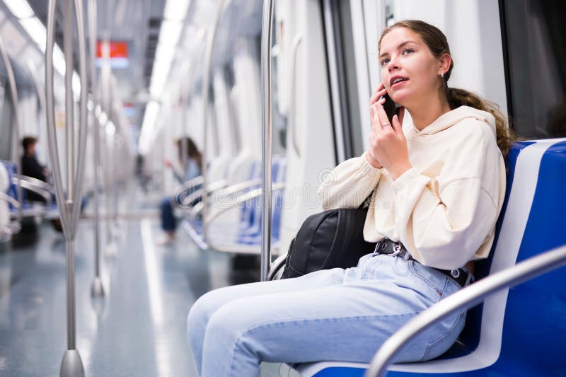 Active Girl Riding on a Subway Train, Talking on a Mobile Phone Stock Photo - Image of journey ...
