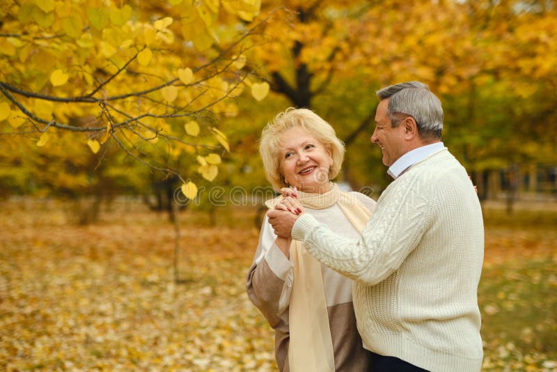 Active Seniors on a Walk in Autumn Forest Stock Photo - Image of male ...