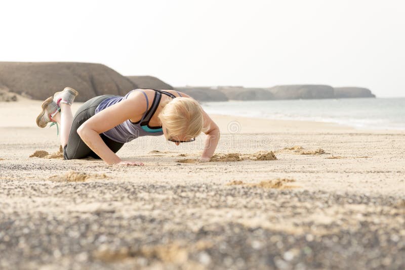 Active Lady Doing Push-Ups by the Seaside Stock Photo - Image of ...