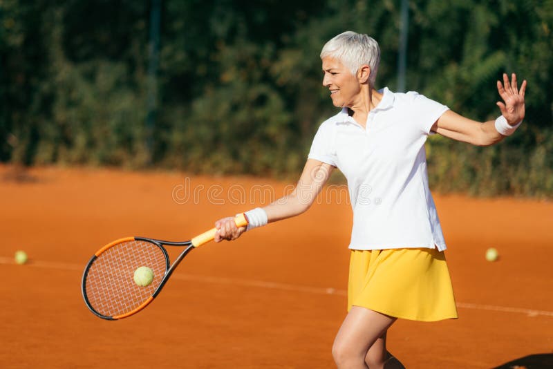 Active Lifestyle Seniors – Positive Mature Woman Playing Tennis