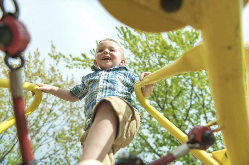 Two Young Children Havinf Fun on a Playground Stock Image - Image of ...
