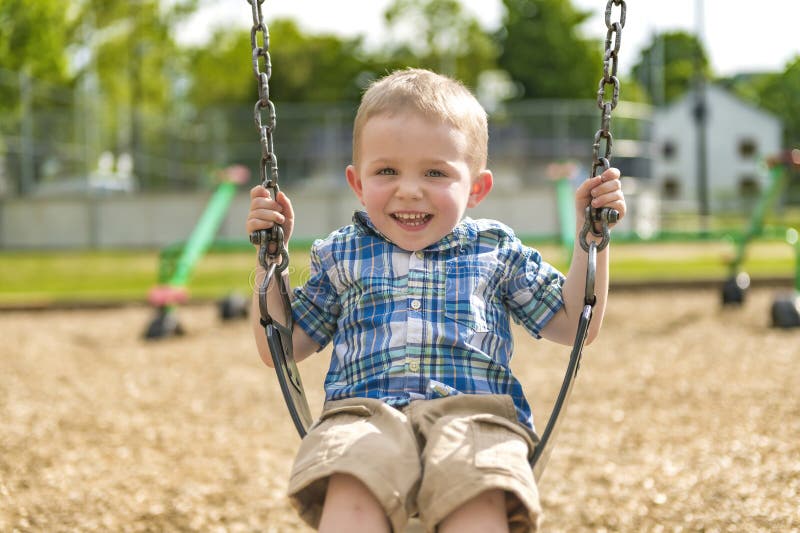 Two Young Children Havinf Fun on a Playground Stock Image - Image of ...