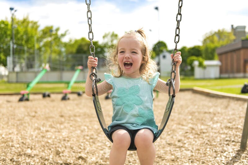 Active Little Girl Having Fun on Swing Playground Stock Photo - Image ...