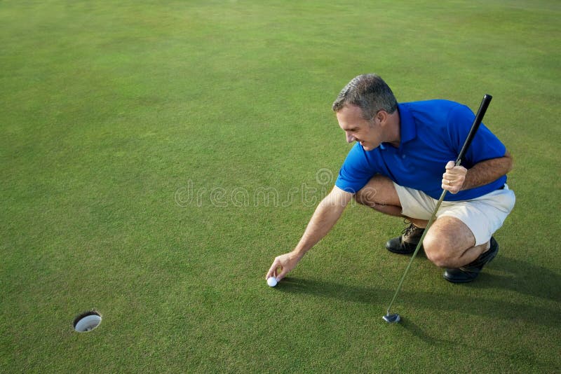 Active Male Golfer Putting stock image. Image of golf - 13562527