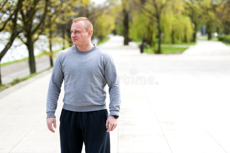 Active Man with Athletic Body, Exercise Outdoor in Park. Fit Look Stock ...