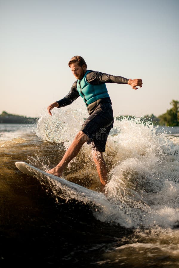 Active Man Balancing on Wave on Wakesurf Board. Stock Image - Image of ...