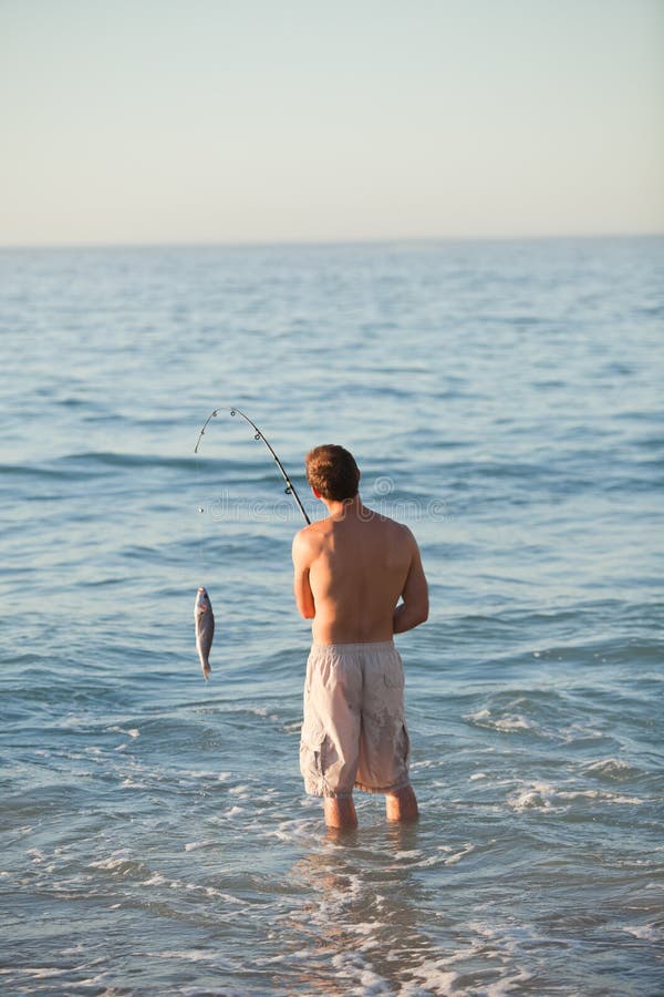 Angler Fisherman Fighting Big Fish Rod and Reel Stock Photo - Image of ...