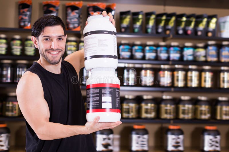 Active Man Holding Sport Nutrition Products Stock Image - Image of ...