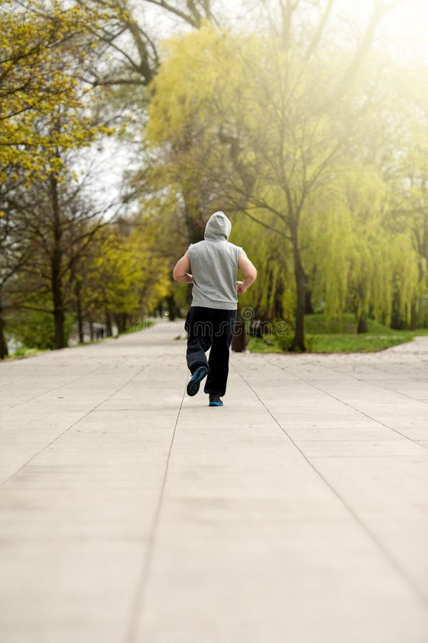 Active Man Jogger Run in Park. Stock Image - Image of shoes, running ...