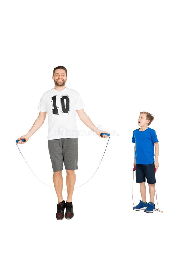 Active Man Jumping with Skipping Rope with Son Standing Near by Stock ...