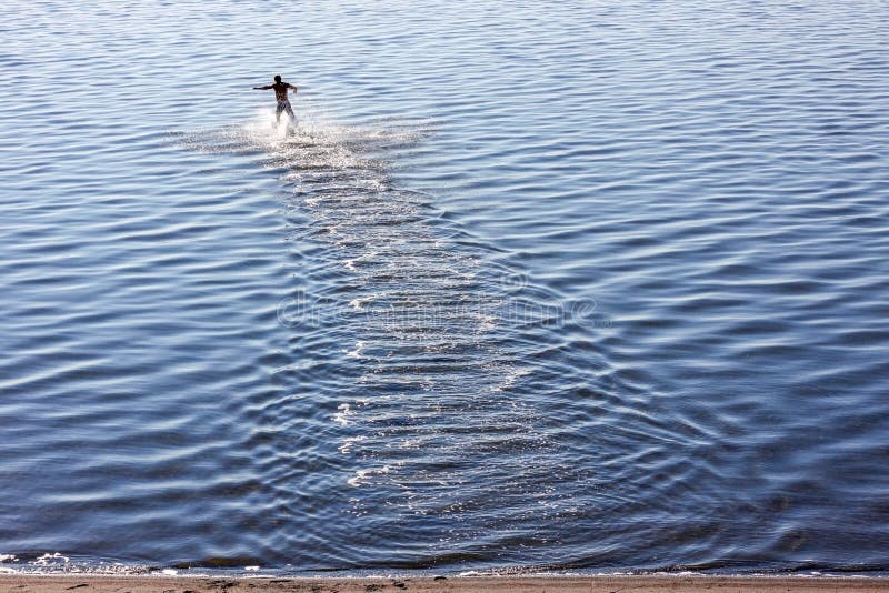 Active Man Running To Swim in Lake with Reflection Stock Photo - Image ...