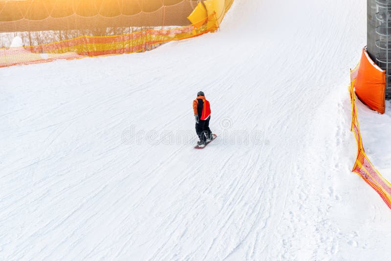 Active Man on Snowboard Move Fast Downhill on Ski Sloe from the ...